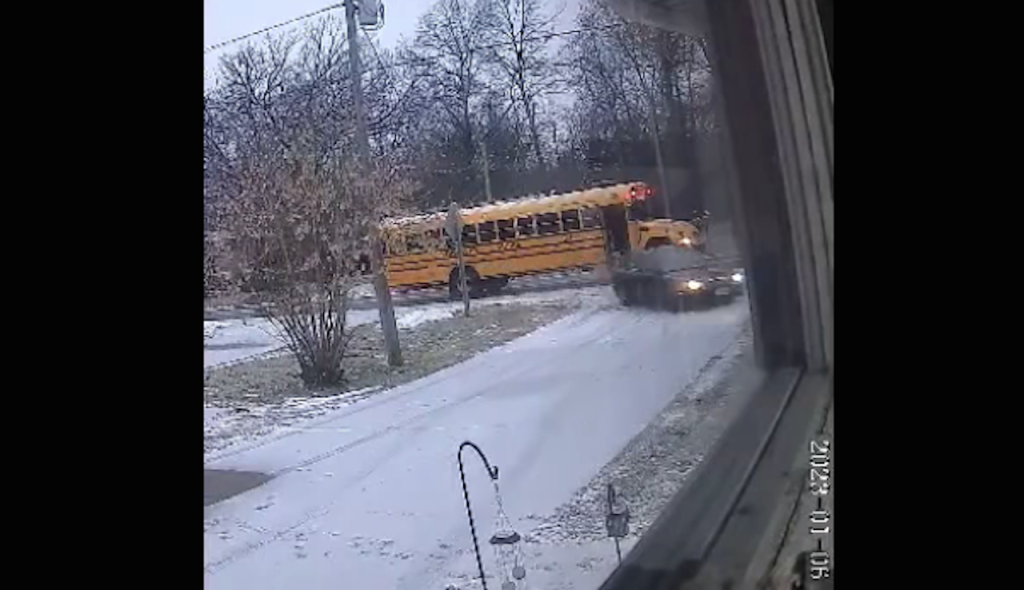 Video: Student nearly hit by car while getting on school bus near ...